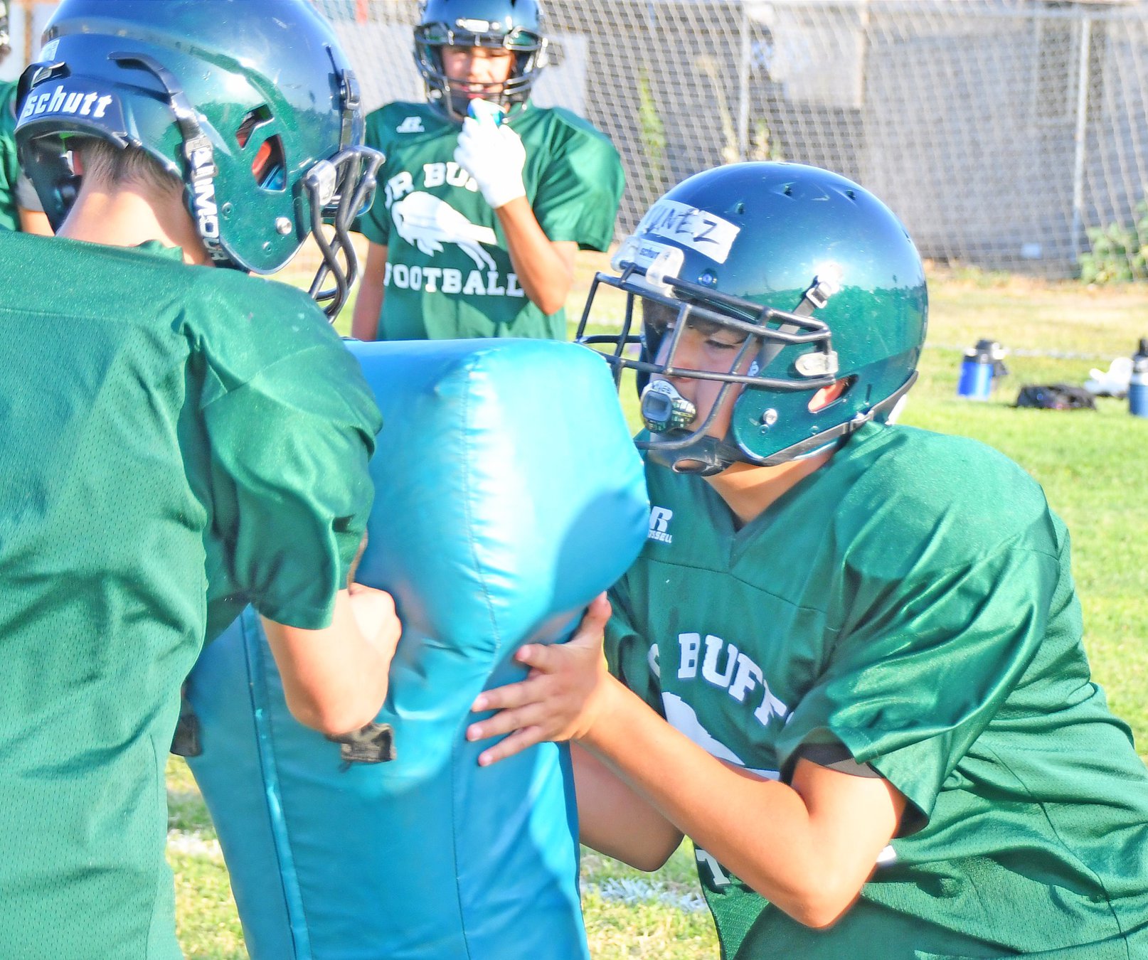 YOUTH GRIDDERS RETURN - Manteca Bulletin