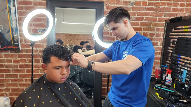 Barber Club gives students fresh look, supplies for back to school ...
