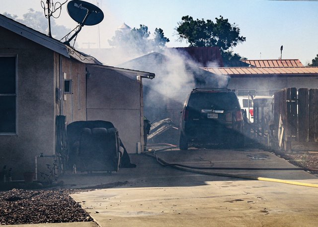 Holiday evening disrupted as fire engulfs garage and vehicle on Wallis ...